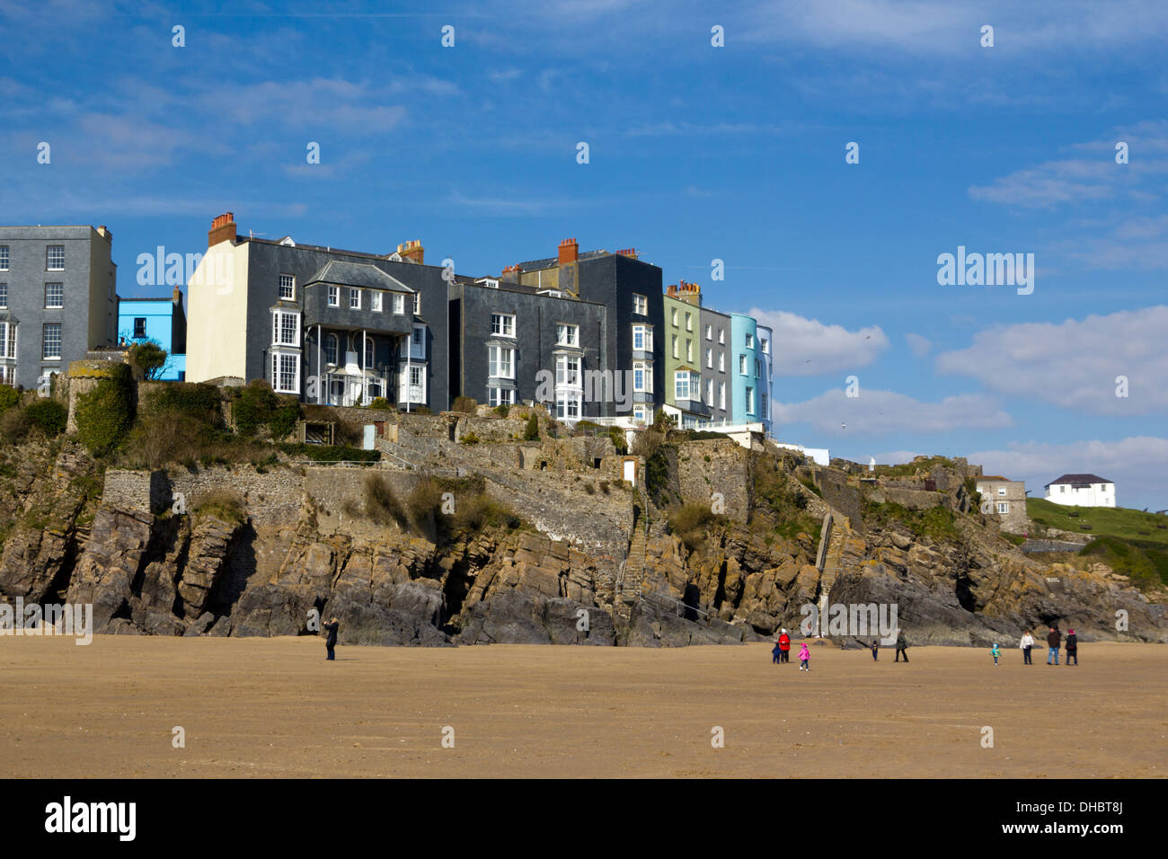 A vibrant blue painted house stands out amongst grey houses on the ...