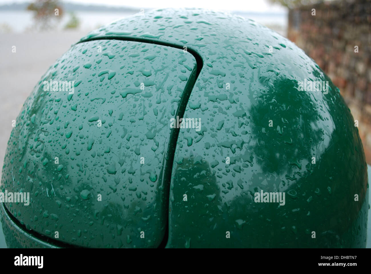 Rain on a Park Trash Container Stock Photo - Alamy