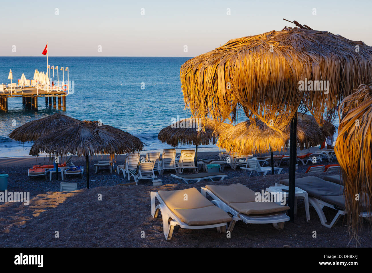 Early morning on a sea beach shined by rising sun Stock Photo - Alamy