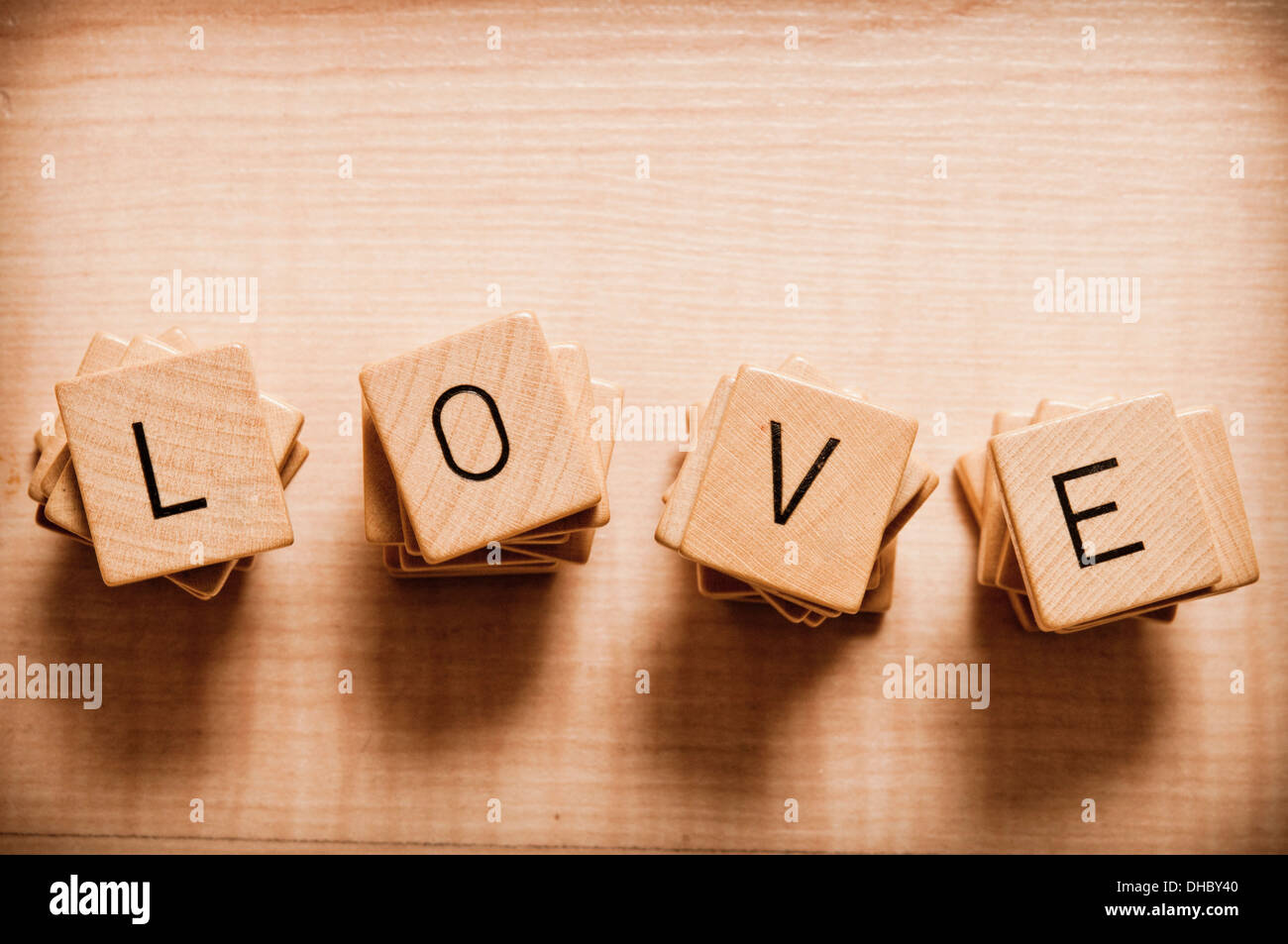 love word written with scrabble tiles Stock Photo - Alamy