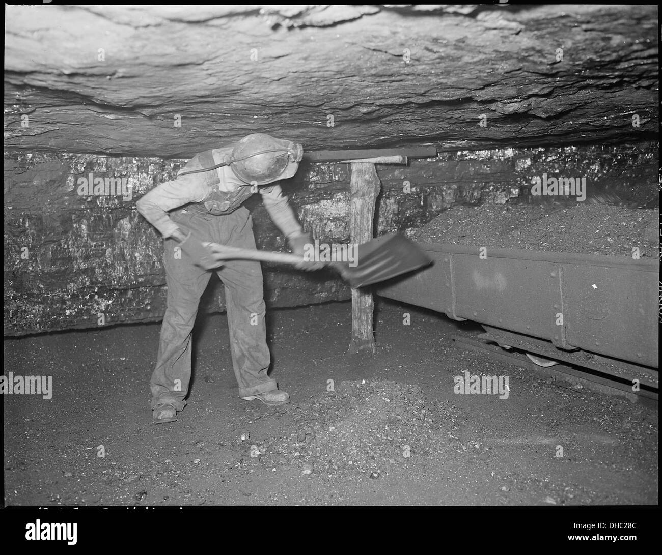 Harry Fain, a coal loader, handles bug dust, a mixture of slate and ...