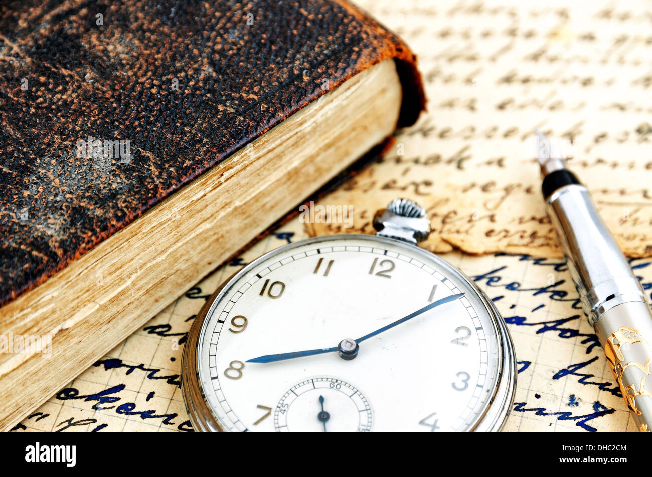 Antique book and pocket watch Stock Photo - Alamy