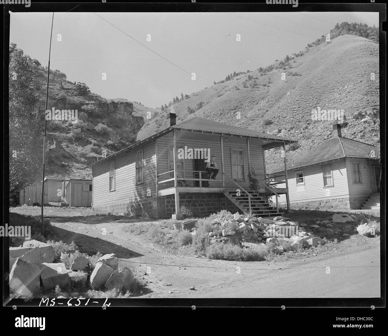 A photograph of the home of a miner living in a company housing project ...