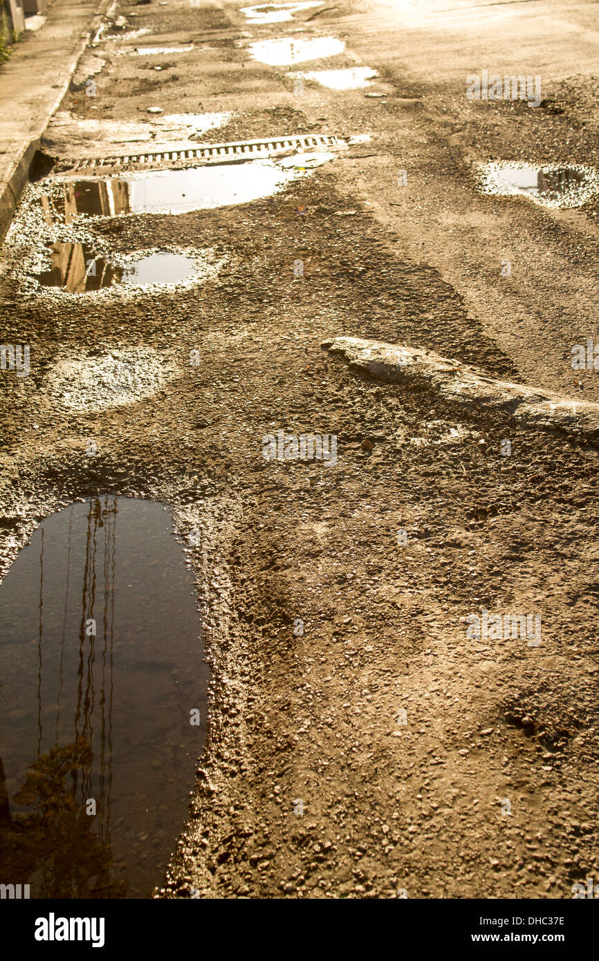 Broken road surface hi-res stock photography and images - Alamy
