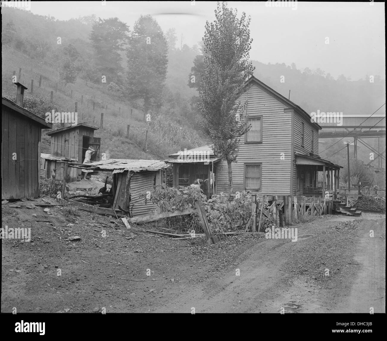 This image shows a house and privies at the Raven Red Ash Coal Company ...