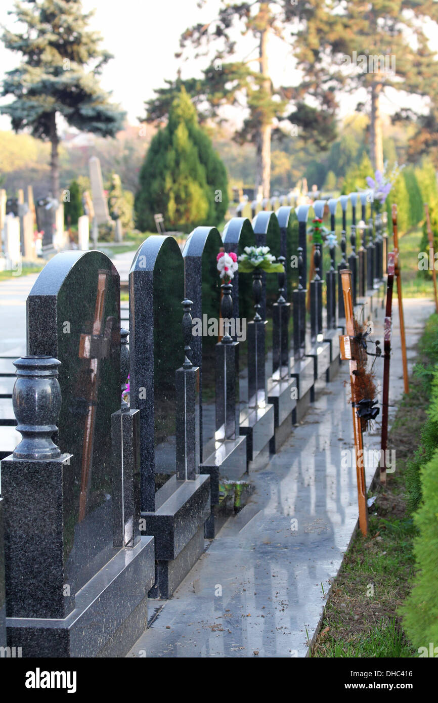 Row of empty tombstone in the graveyard Stock Photo - Alamy