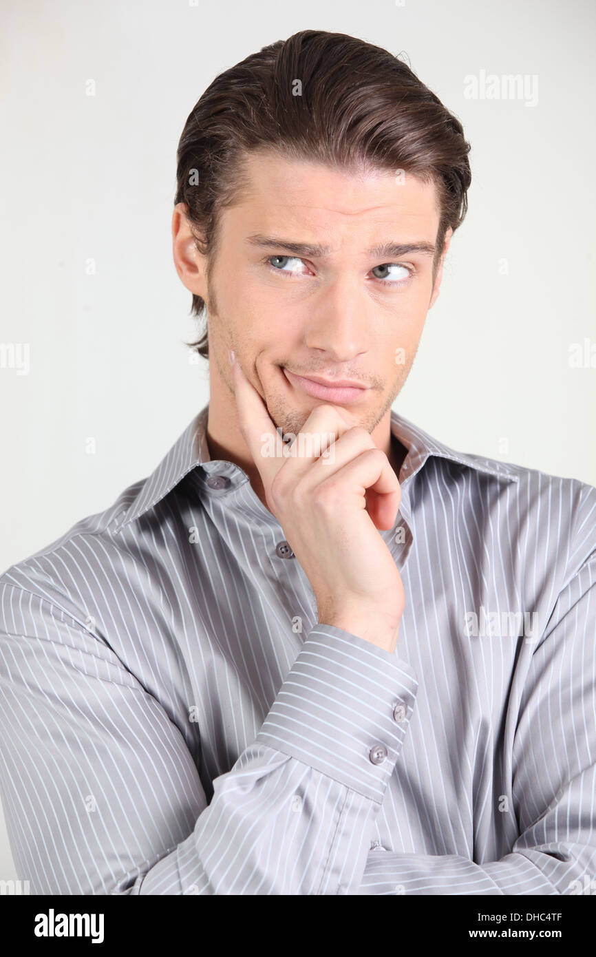 Smart man looking indifferent Stock Photo - Alamy
