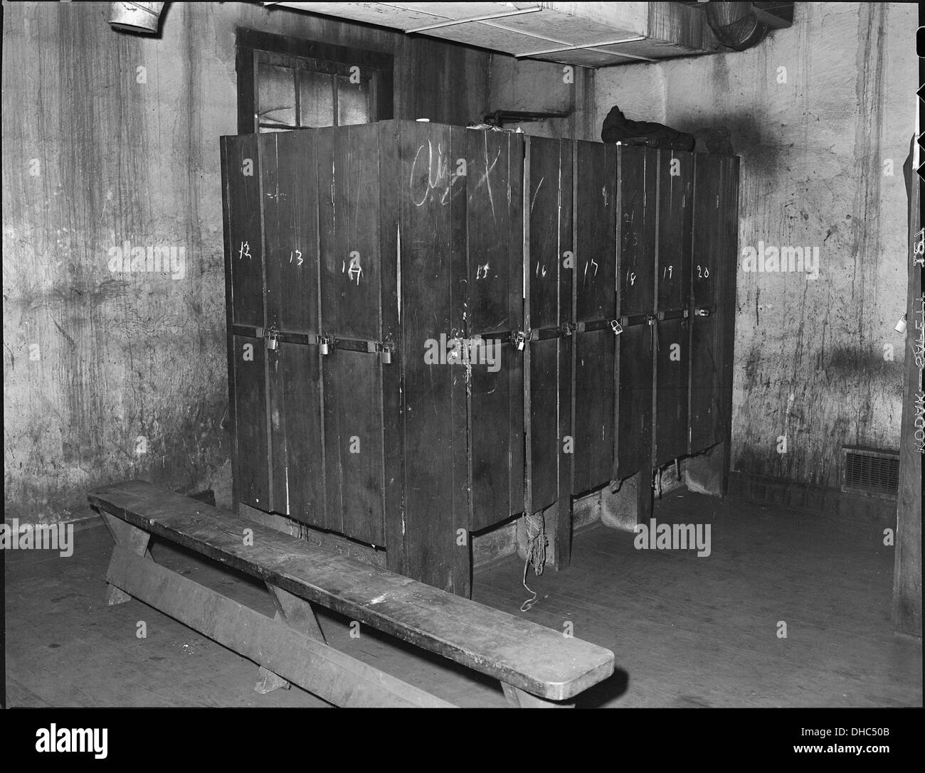 This photograph depicts a locker room in a washhouse used by miners at ...
