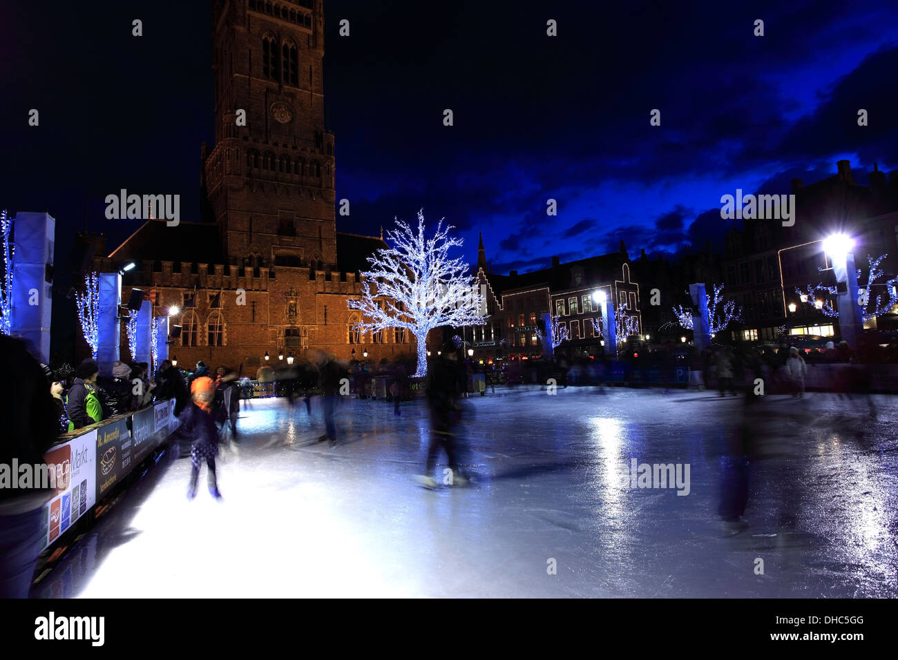 Panned camera effect on People skating on the Christmas Ice rink ...
