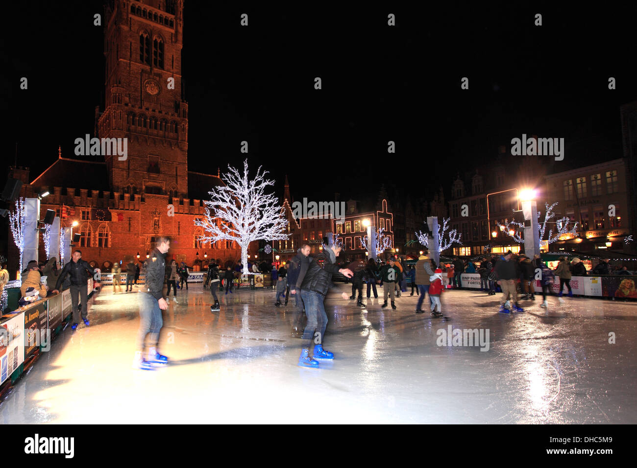 Panned camera effect on People skating on the Christmas Ice rink ...