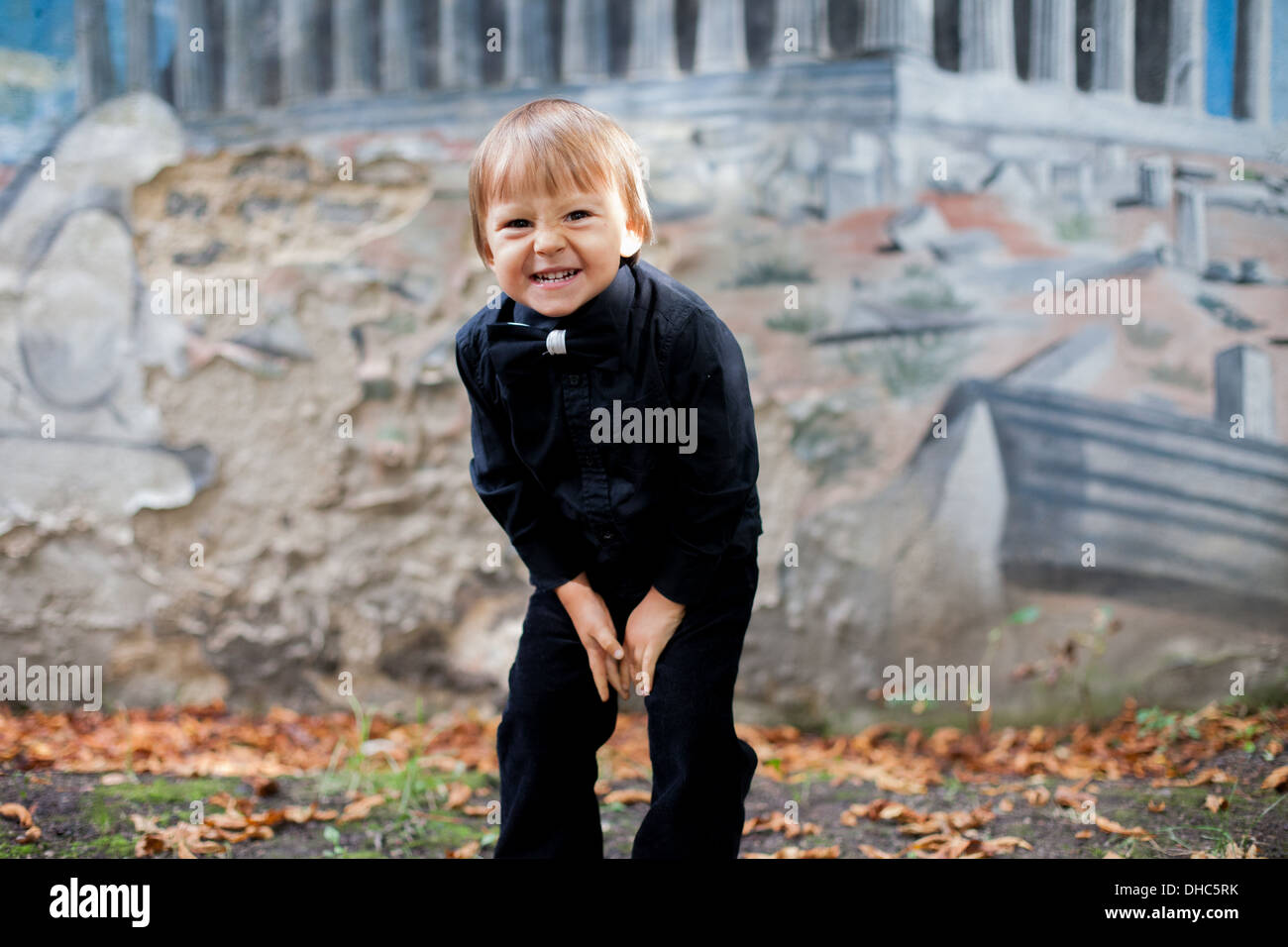 Boy with a bow posing Stock Photo - Alamy