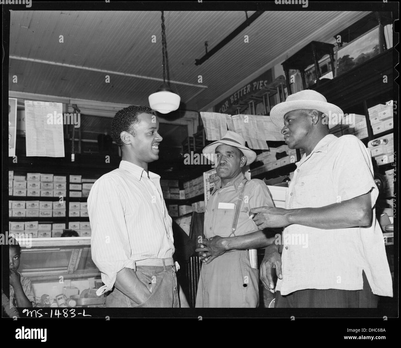 James Robert Howard, seen on the left, interacts with fellow miners in ...
