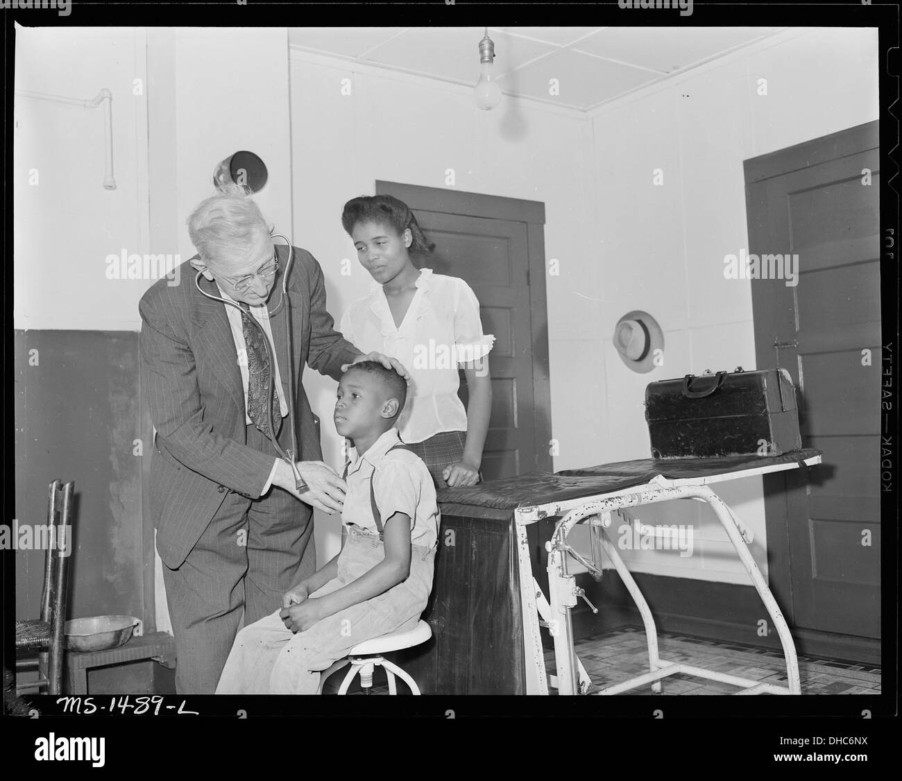 Mrs. James Robert Howard and her son are photographed with Dr. J.A ...