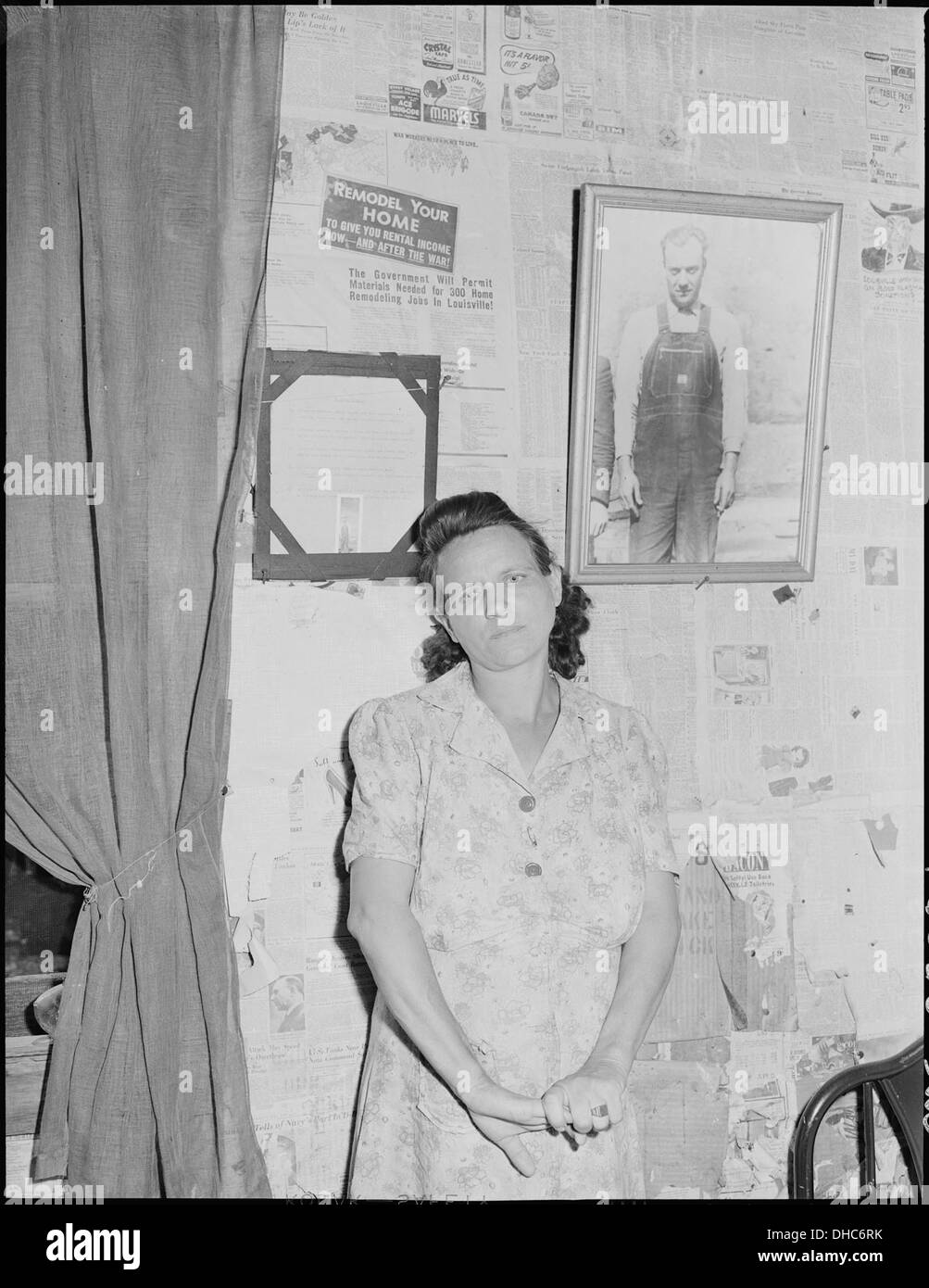Mrs. Leanore Miller, widow of a miner, is pictured holding a photograph ...
