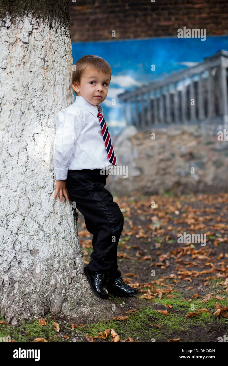 Boy with a tie, posing Stock Photo - Alamy