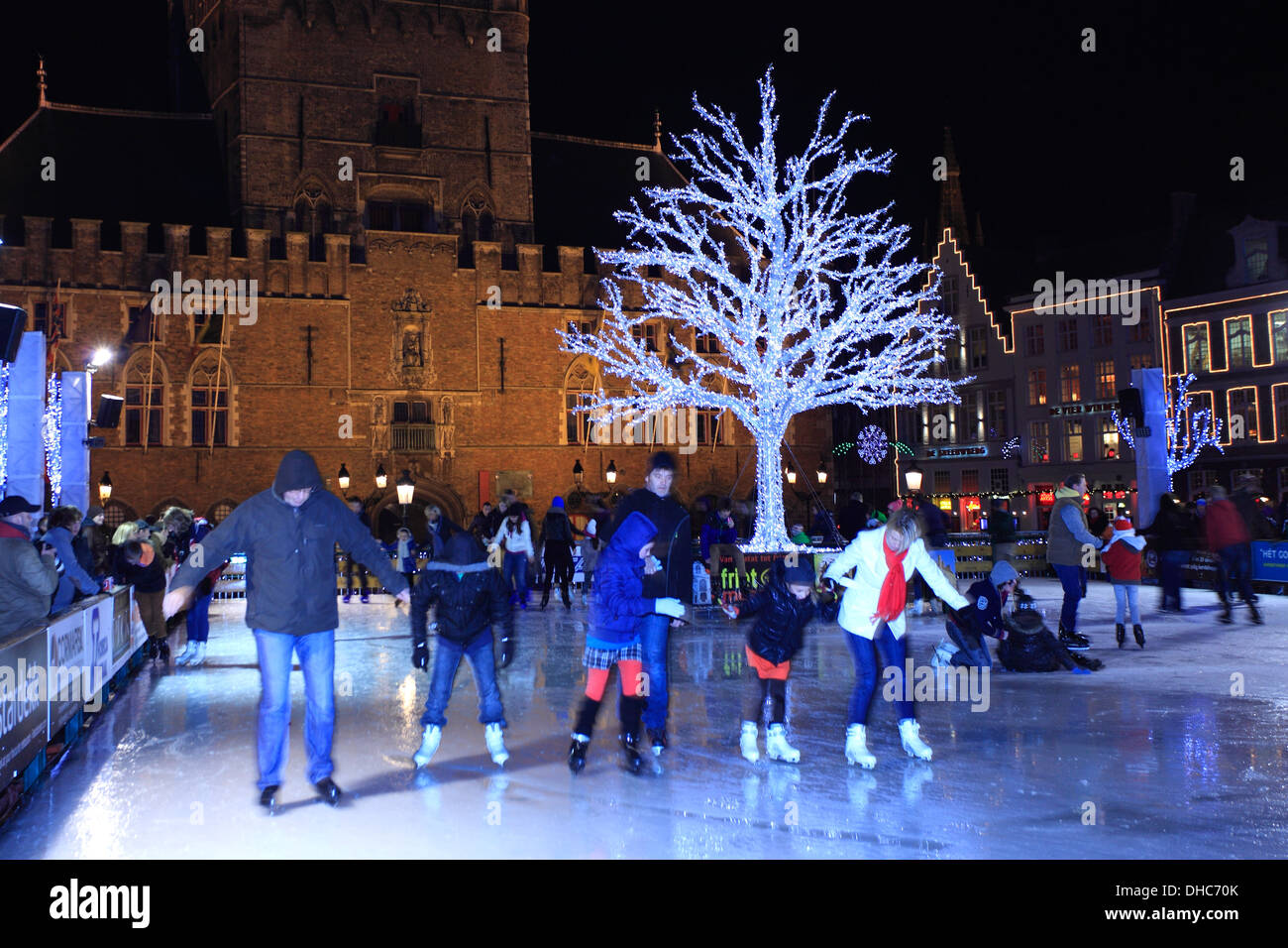 Panned camera effect on People skating on the Christmas Ice rink ...