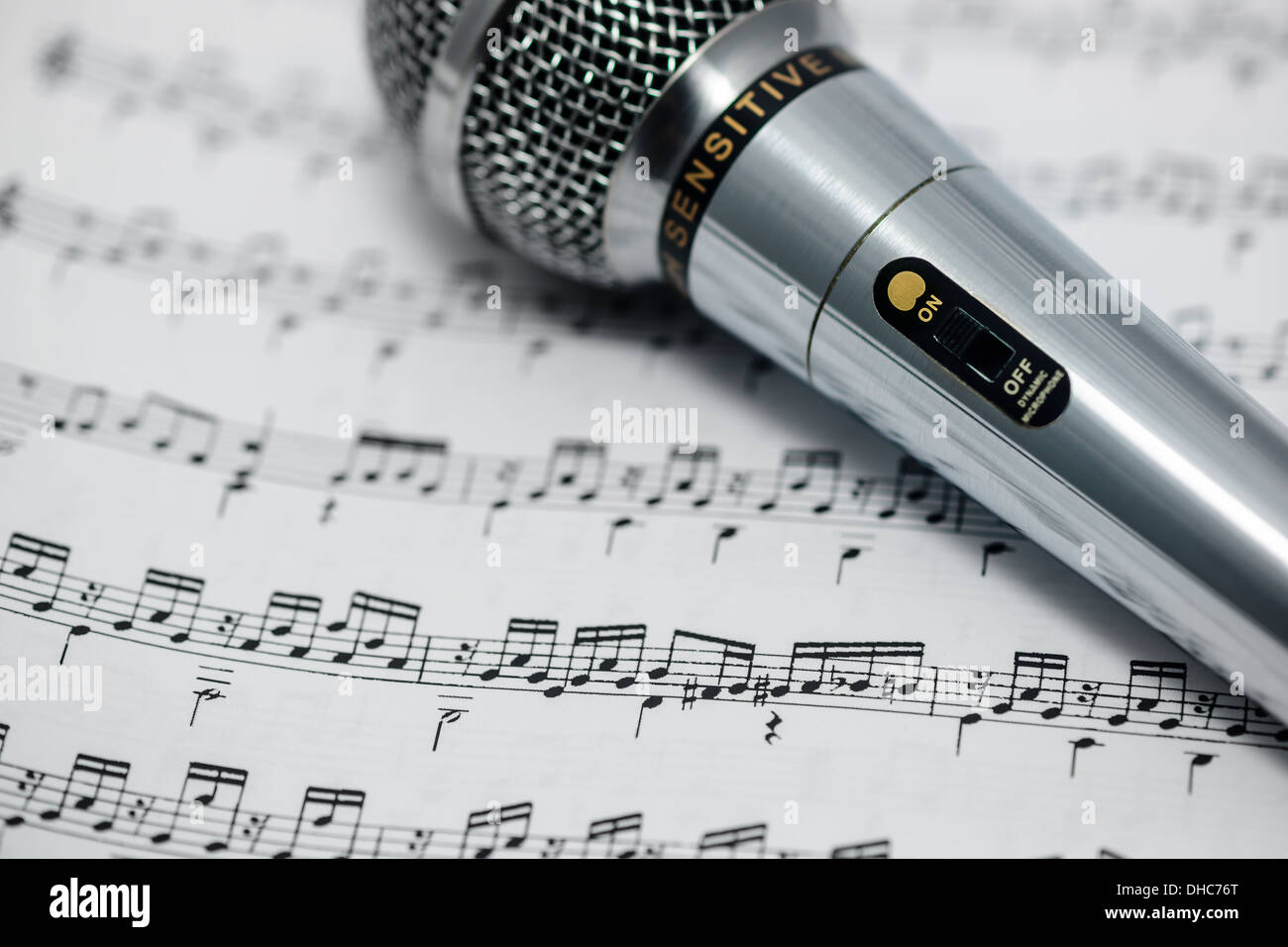 Included is a metal microphone on white paper with notes Stock Photo ...