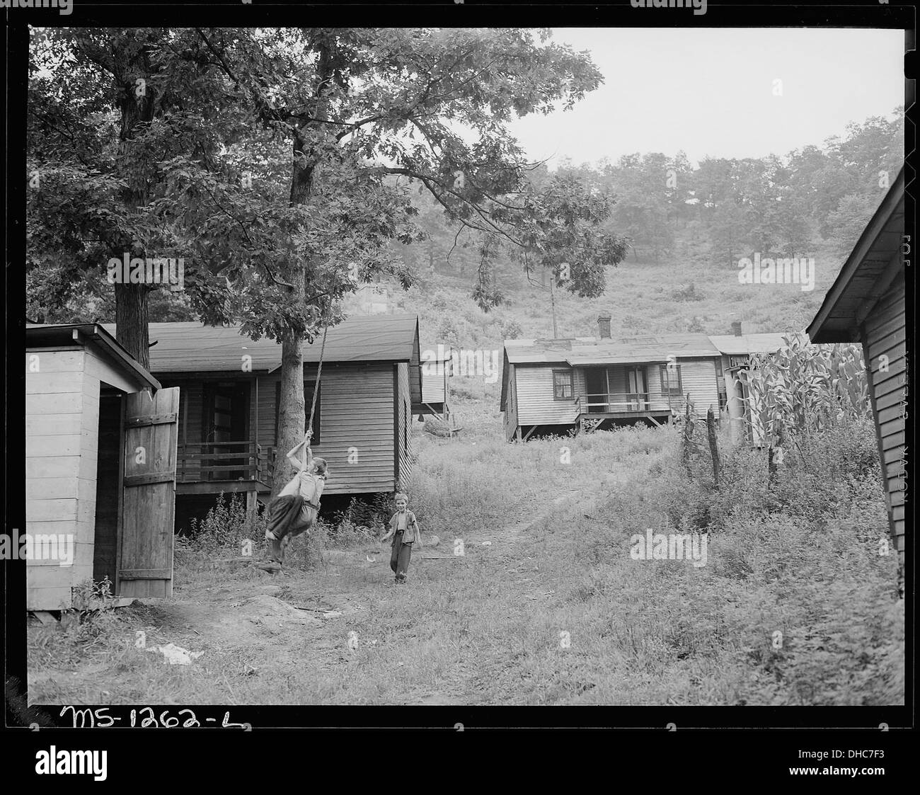 Children play unsupervised at a mining camp, with no organized ...