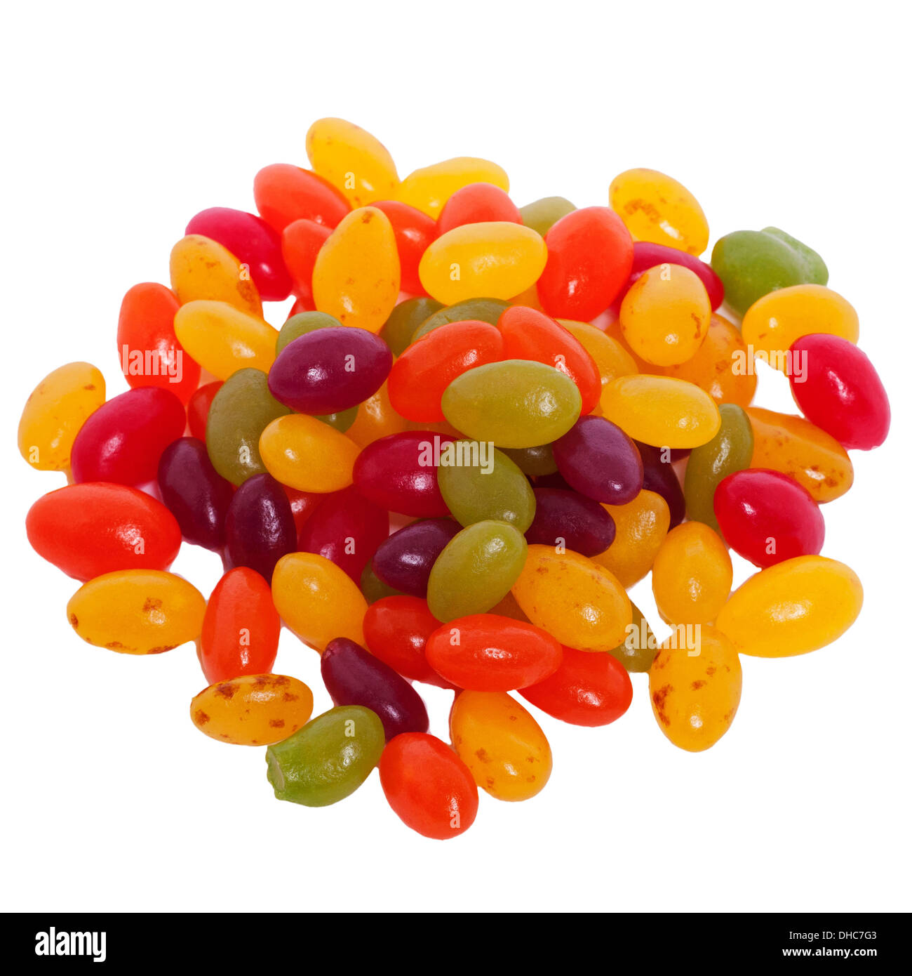 A selection of coloured jelly beans candy sweets on a white background ...