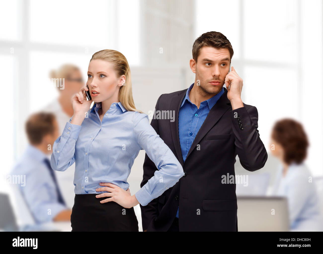 woman and man with cell phones calling Stock Photo - Alamy