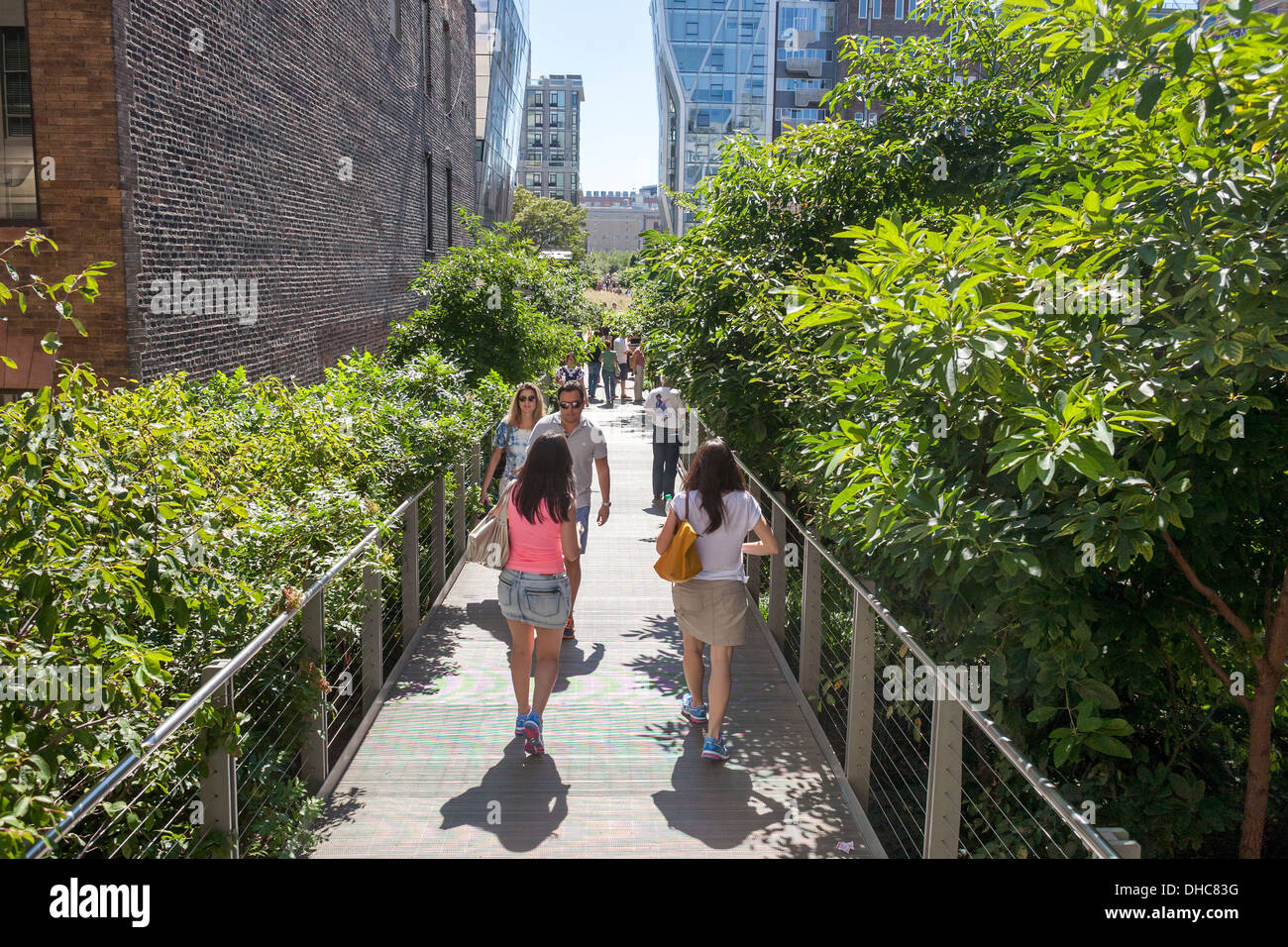 Pedestrians walking along the High LIne Park in Manhattan, New York ...