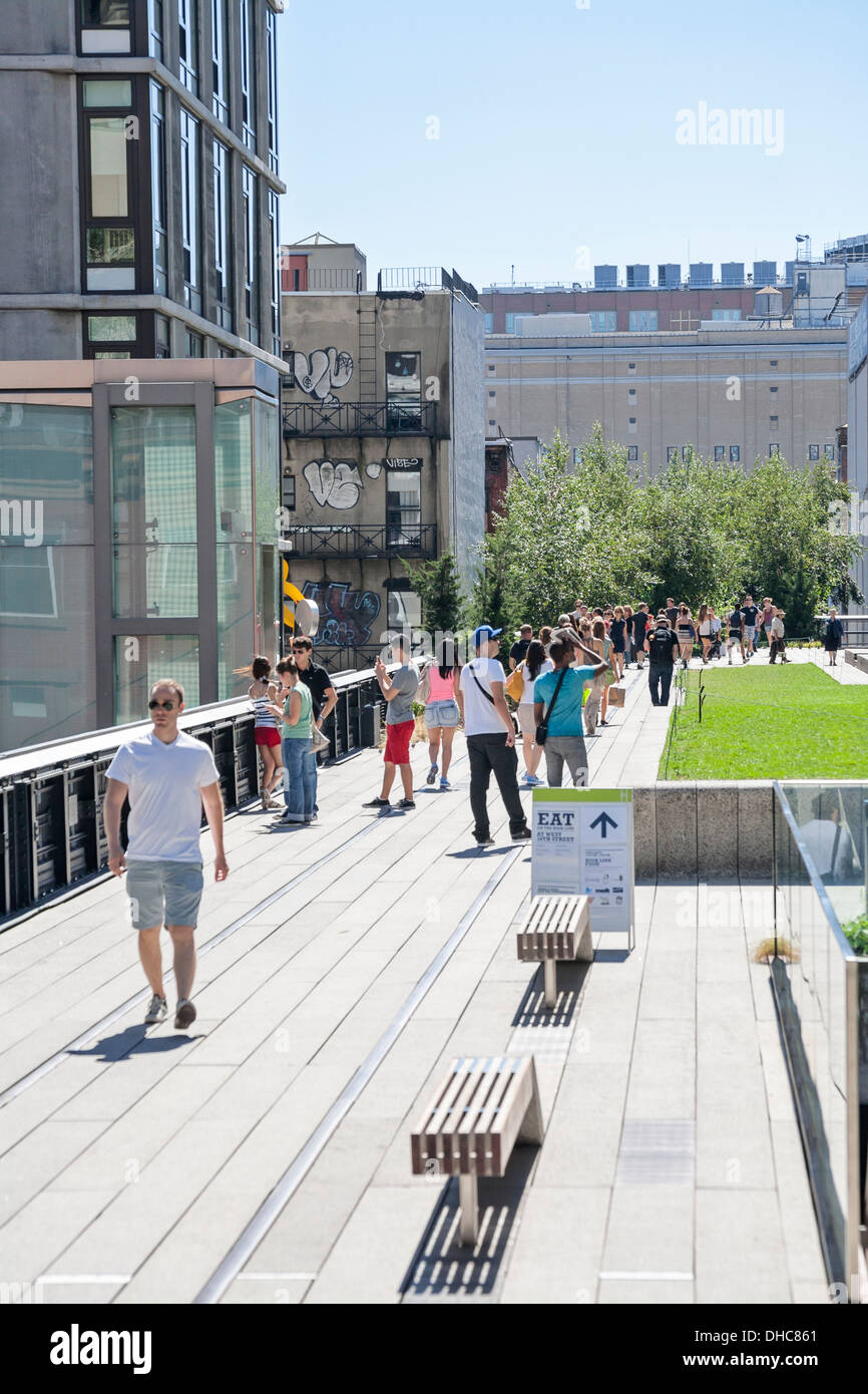 Pedestrians walking along the High LIne Park in Manhattan, New York ...