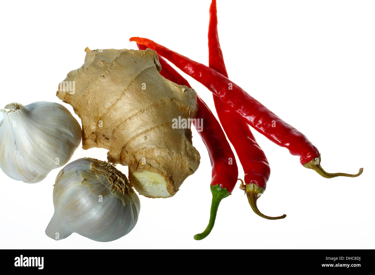 Collection of garlic, ginger and chillies on a white background Stock ...