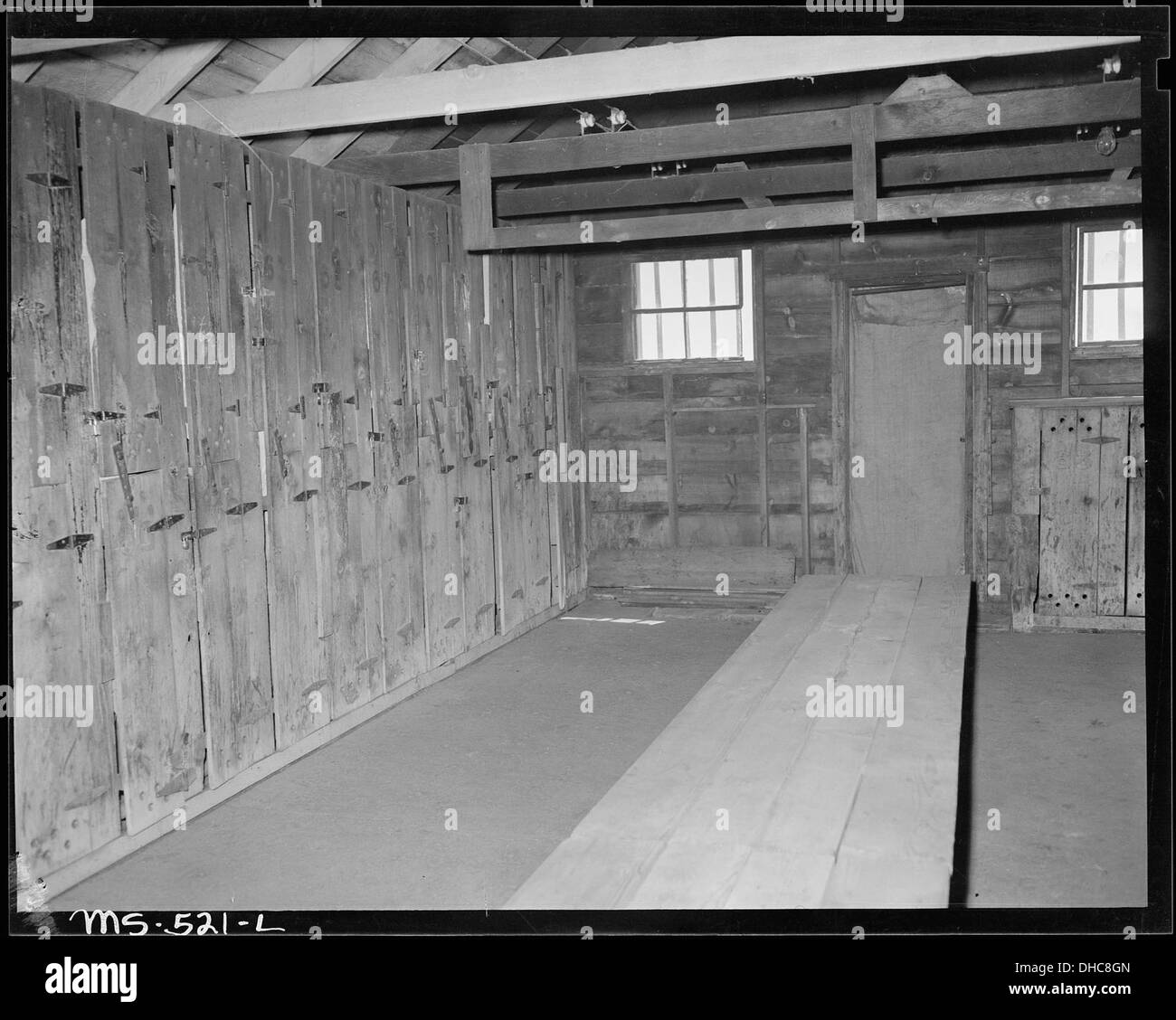 The image shows a section of a wash and change house used by miners. It ...