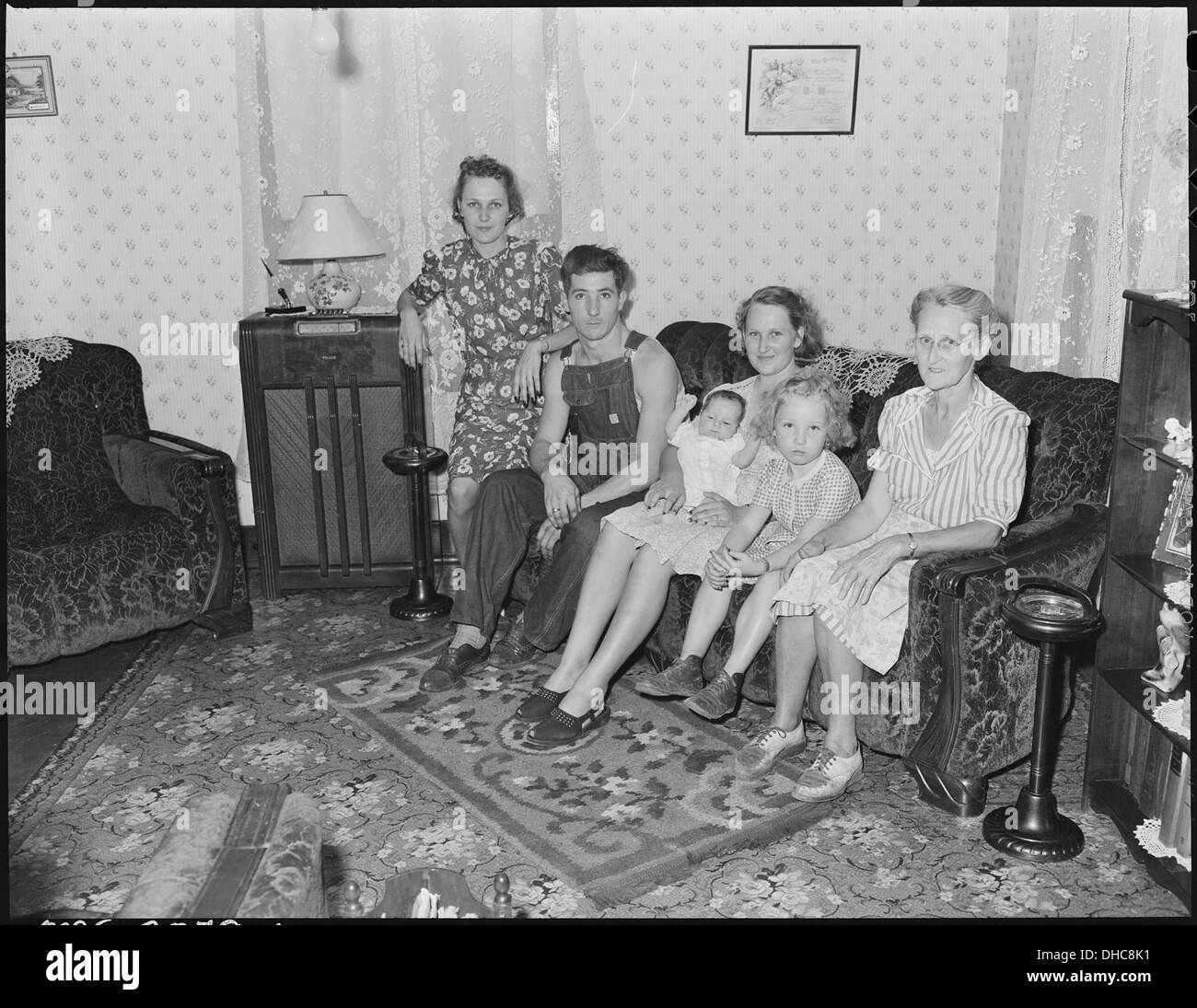 This image shows Carl Ruth, a coal miner, with his family. The photo ...