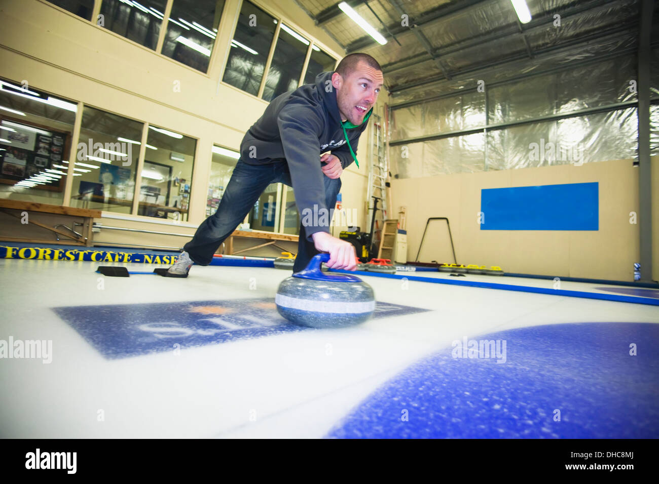 A Man Curling; Naseby, Otago, New Zealand Stock Photo - Alamy