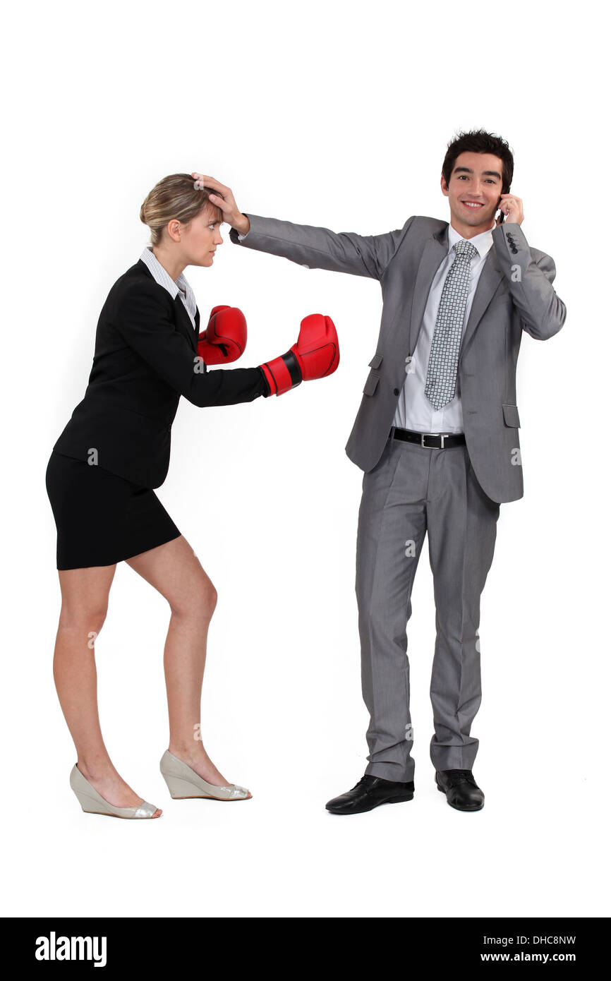 man on the phone and woman with boxing gloves Stock Photo - Alamy