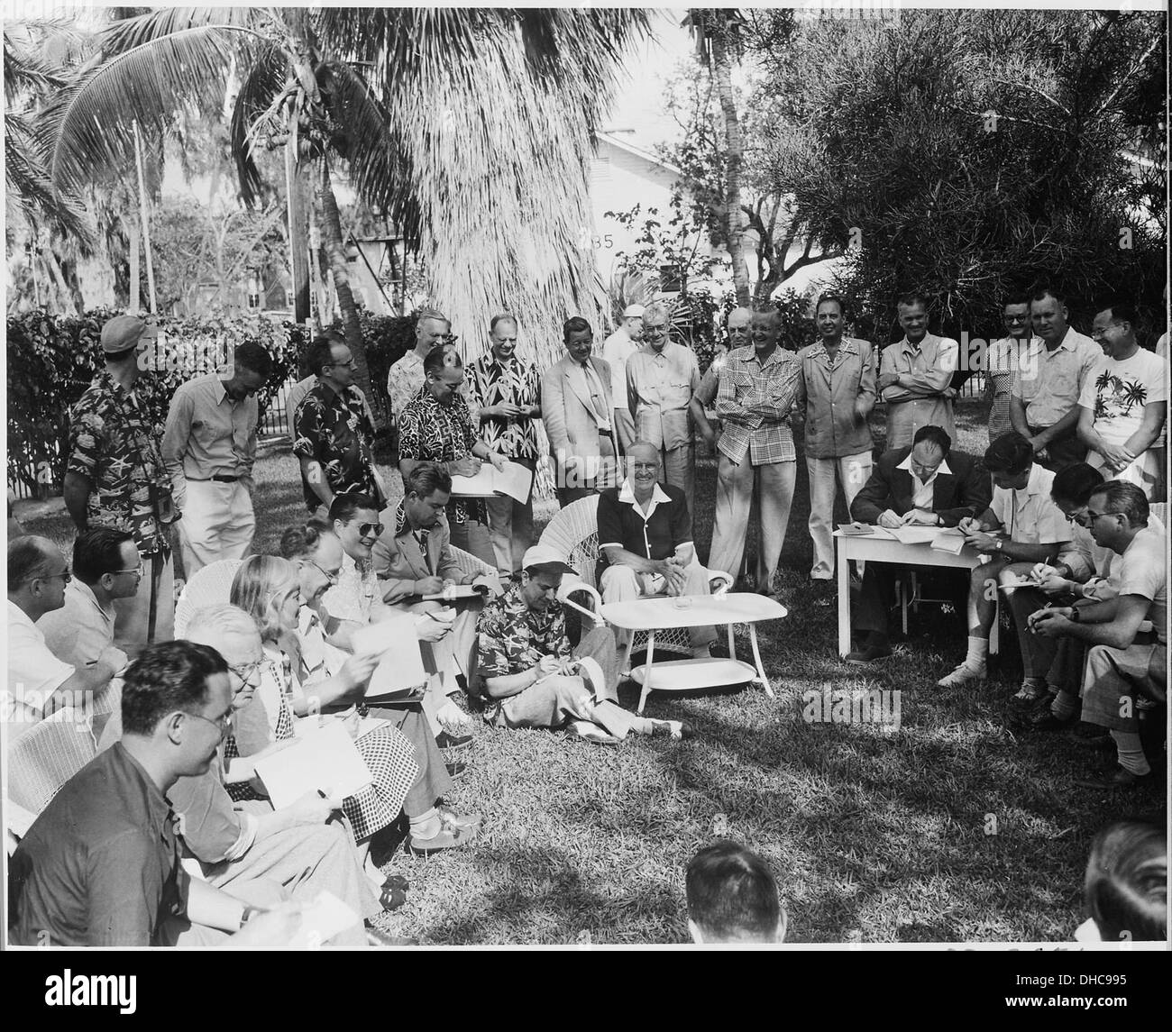 President Harry S. Truman is captured smiling during a press conference ...