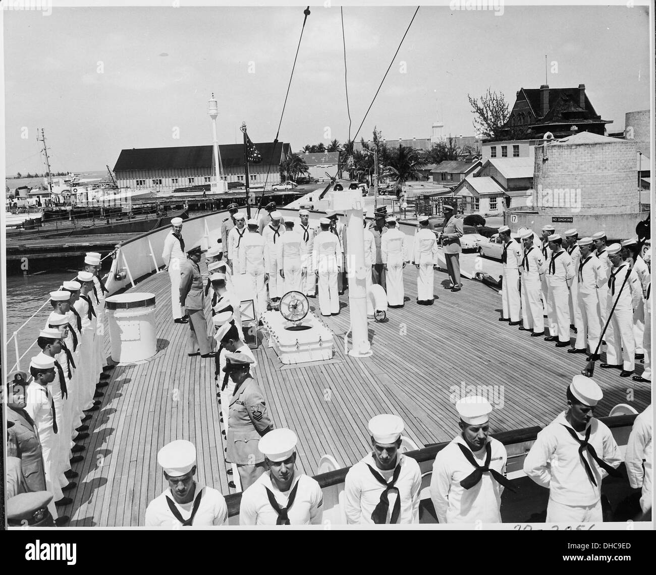 This photograph shows sailors standing at attention aboard the U.S.S ...