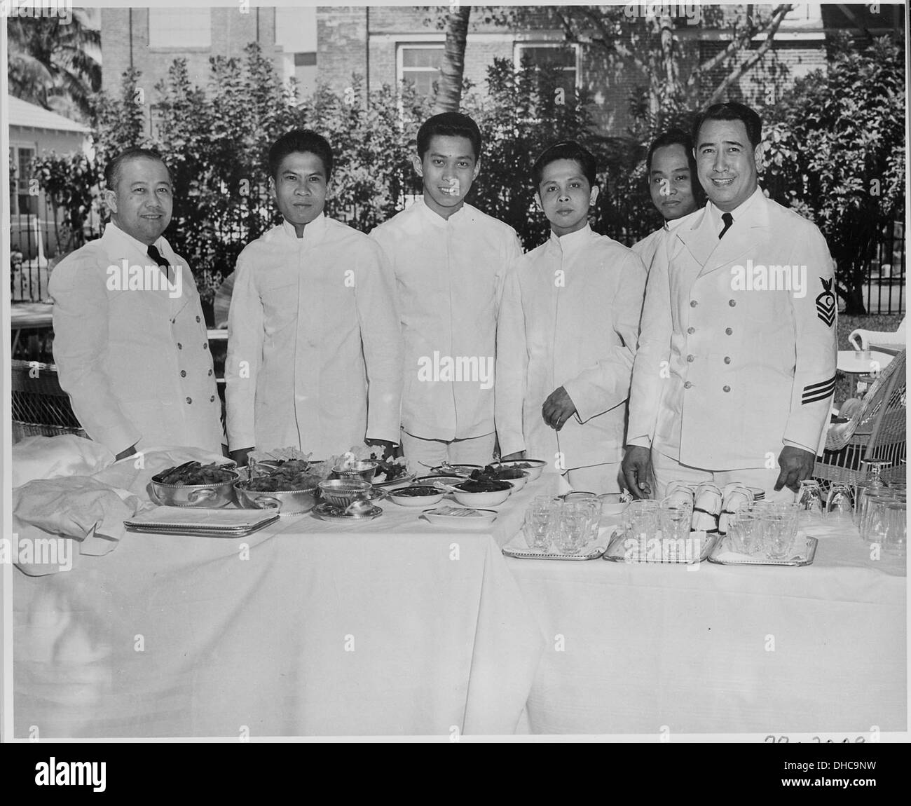 Stewards are seen preparing to serve lunch to the President's party ...