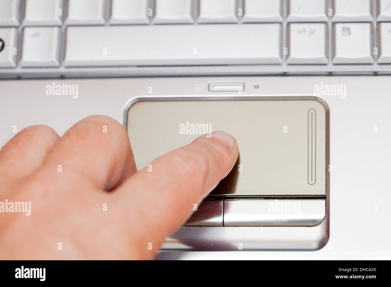 Human finger on touchpad keyboard hi-res stock photography and images ...