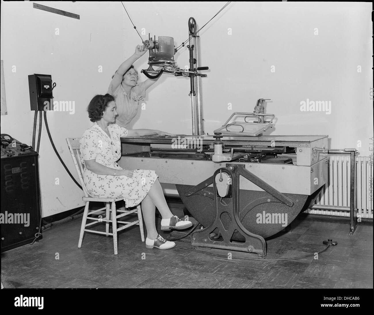 Worker adjusting machine Black and White Stock Photos & Images - Alamy