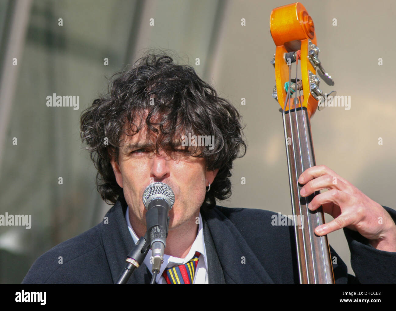 Busker playing double bass and singing in Bournemouth town center ...