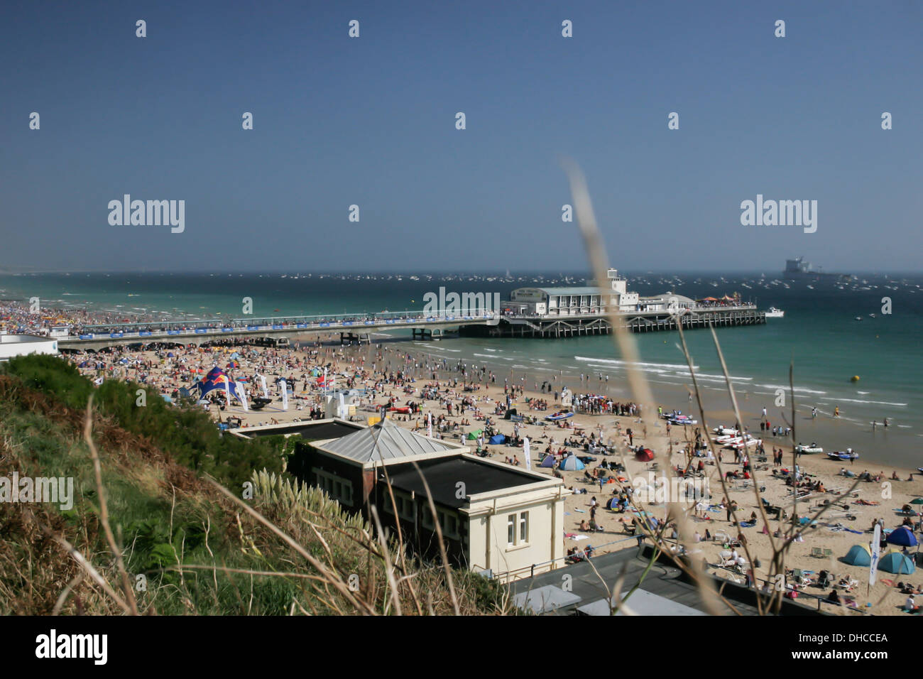View of Bournemouth Beach and Pier from cliff top. People on the beach ...