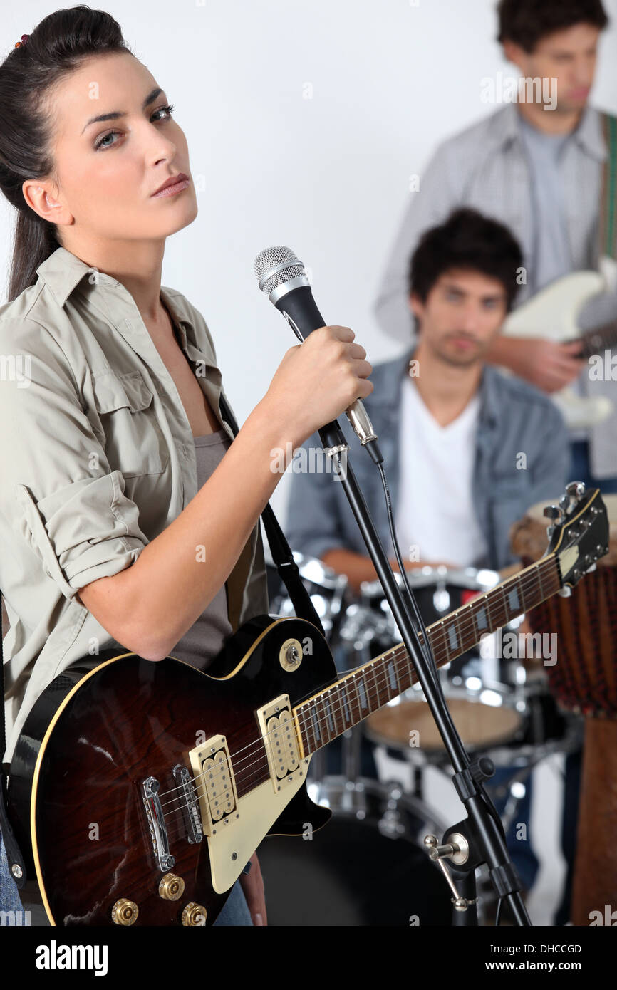 Female singer in a band Stock Photo - Alamy