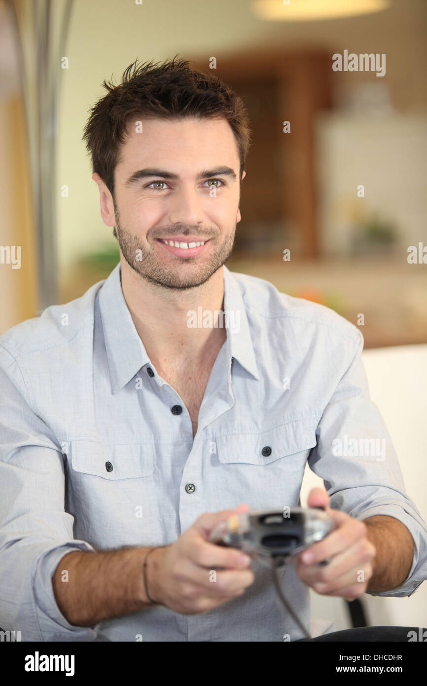 Man playing video games Stock Photo - Alamy