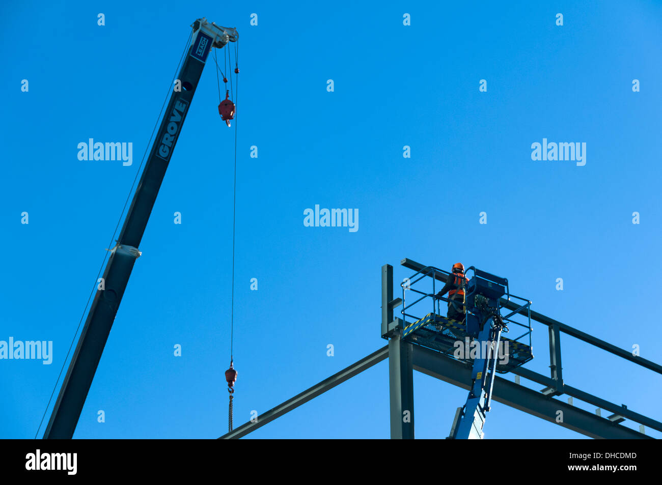 Crane jib and steel erector workman on an access platform, 1 Hardman ...