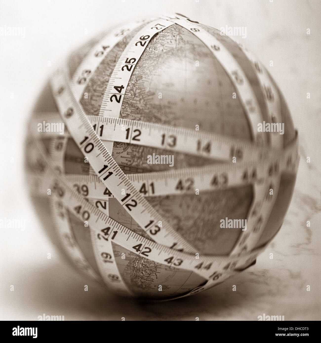 Measuring Tape Wrapped Around Globe Stock Photo - Alamy