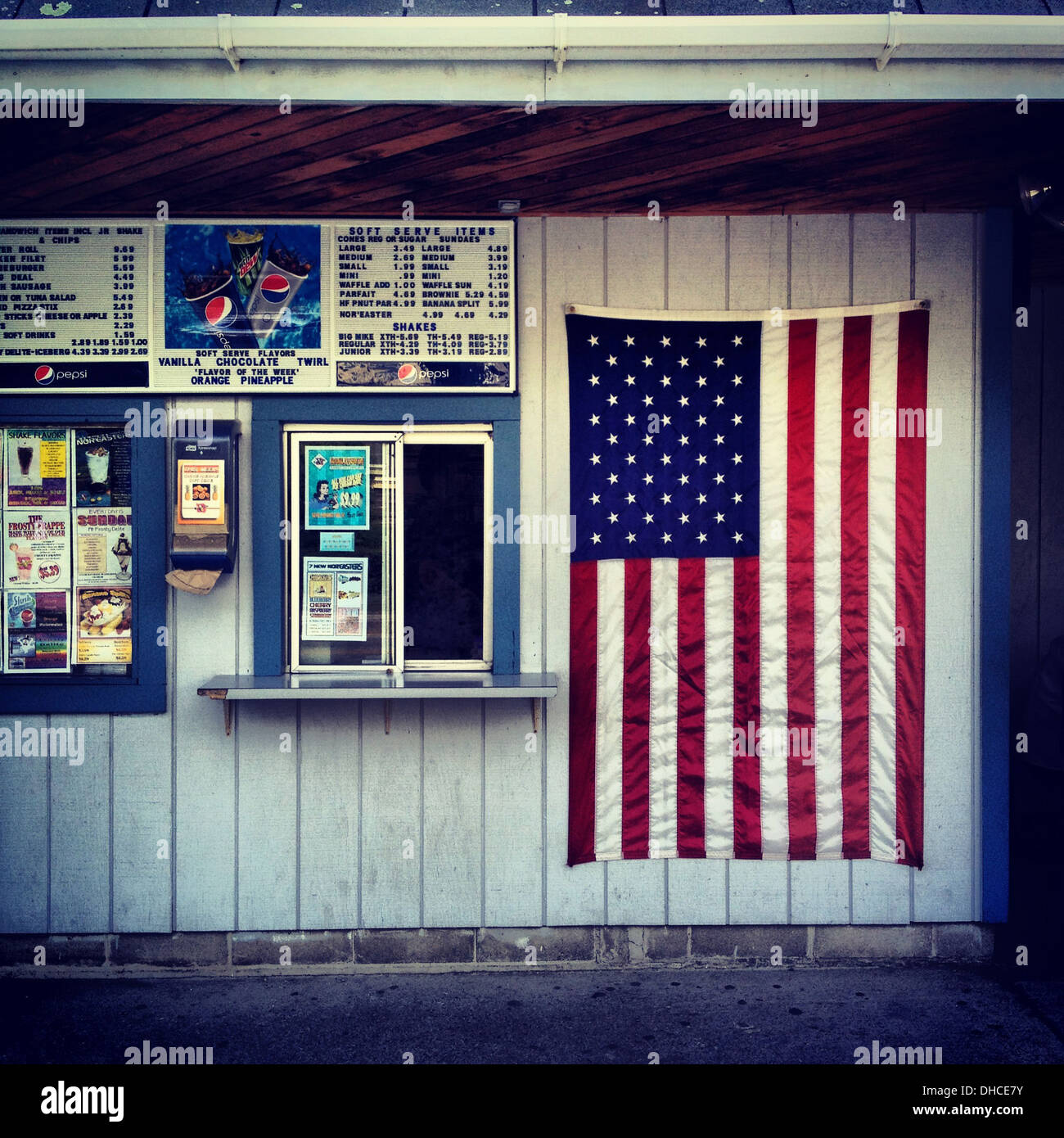 American Flag Next to Walk-Up Window at Ice Cream Store Stock Photo - Alamy