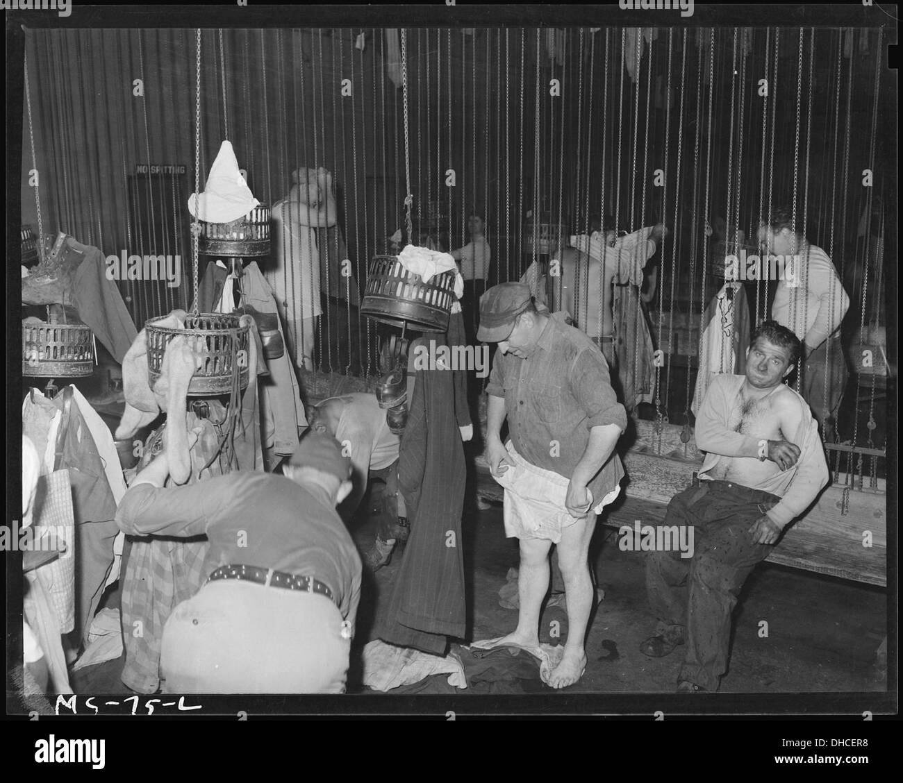 A photograph showing the wash and change house for miners, with John ...