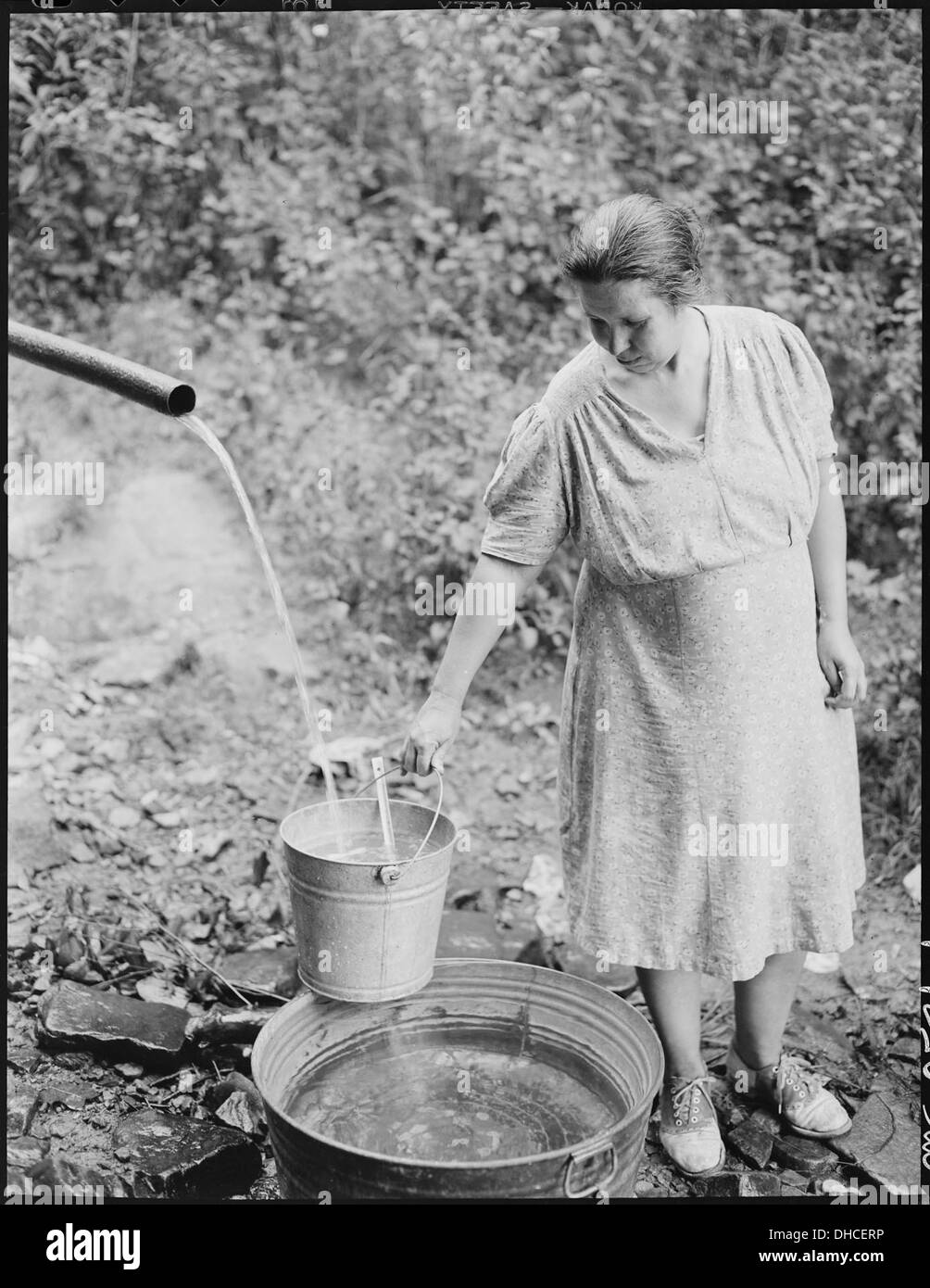 This photograph shows the water supply arrangement for miners' families ...