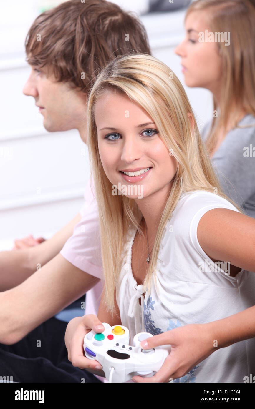 Playing together to video games Stock Photo - Alamy