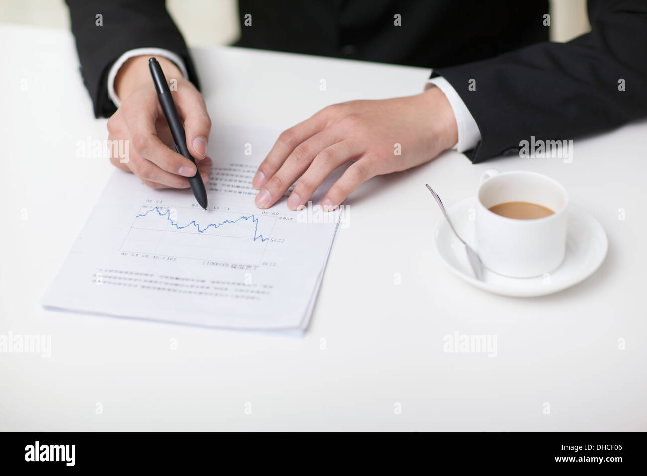 Portrait of young businessman writing in office,close-up Stock Photo ...
