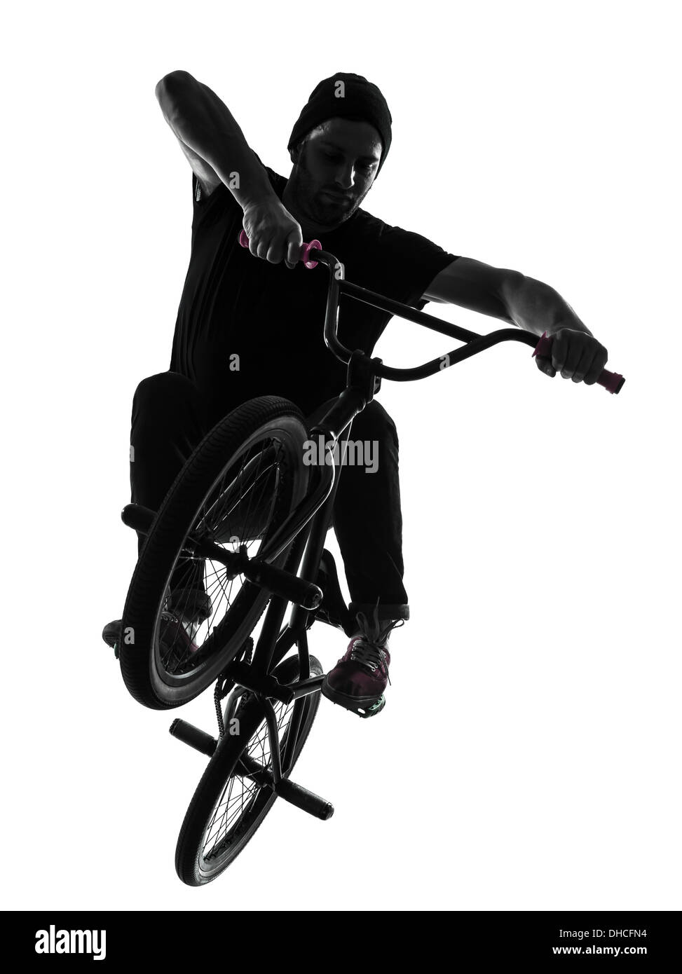 one man exercising bmx acrobatic figure in silhouette studio isolated ...
