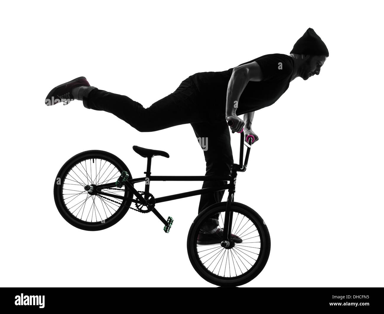 one man exercising bmx acrobatic figure in silhouette studio isolated ...