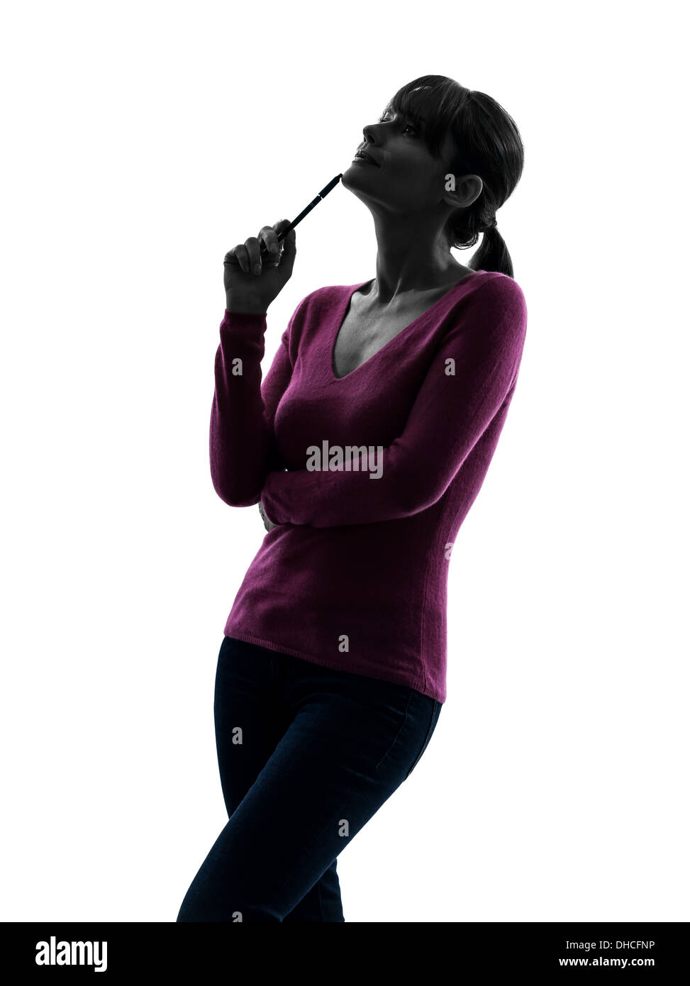 one woman thinking looking up portrait in silhouette studio isolated on ...